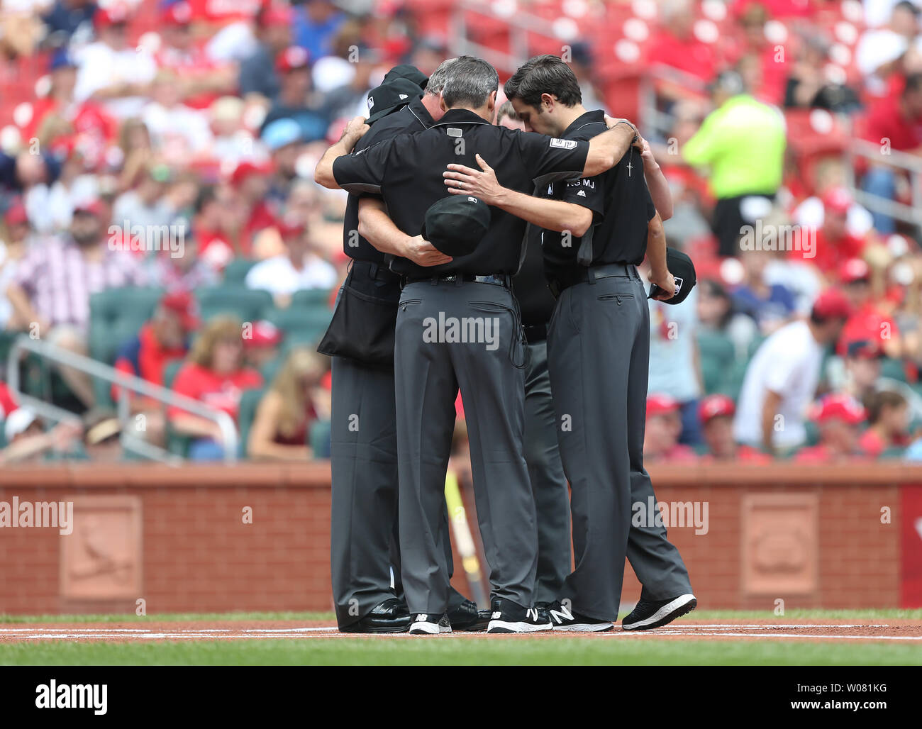 Major League umpires Ted Barrett (L) , Angel Hernandez (C) , John ...