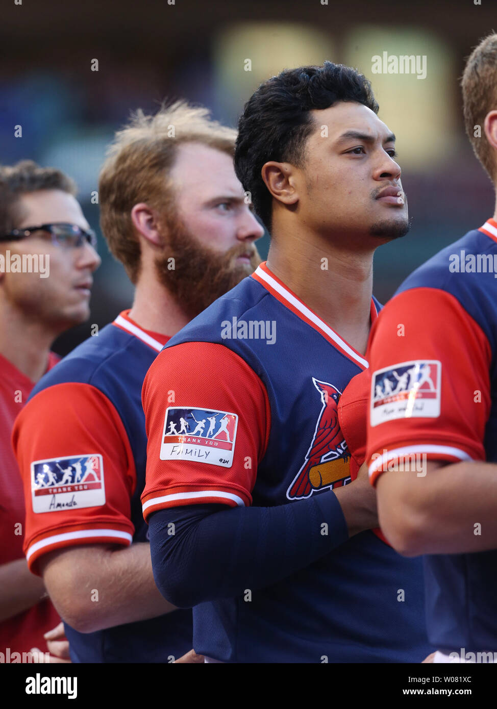 St. Louis Cardinals Sam Tuivailala stands with teammates for the ...