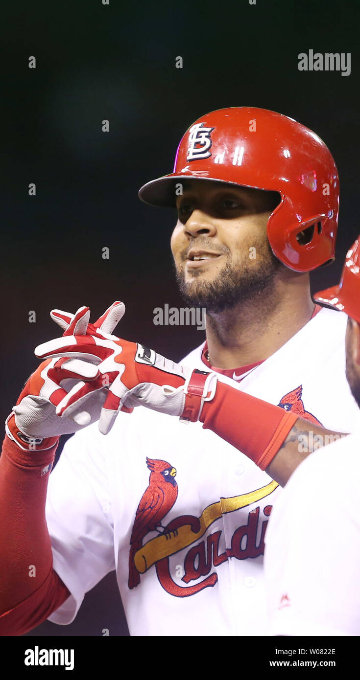 St. Louis Cardinals Jose Martinez motions to his dugout after hitting a ...