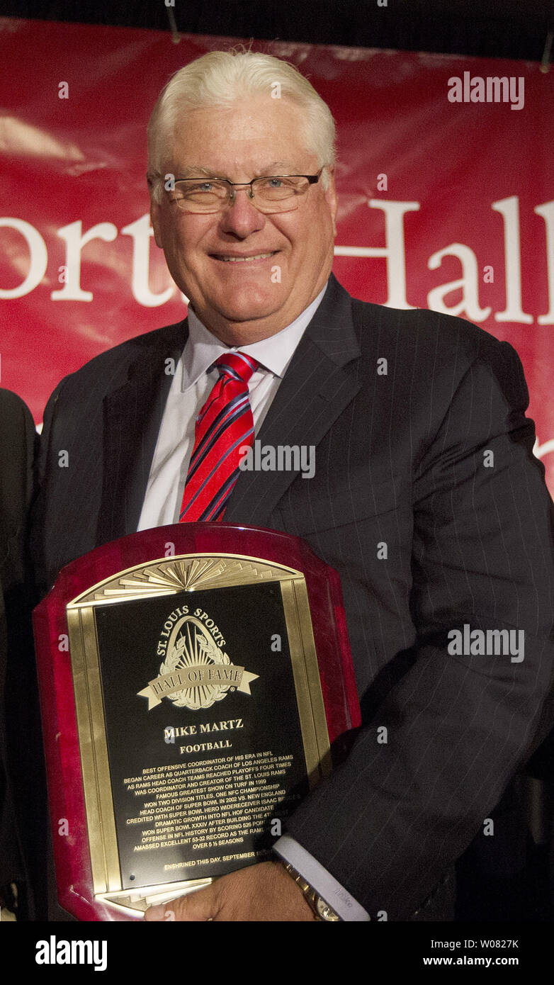 Former St. Louis Rams head football coach Mike Martz holds his placque ...
