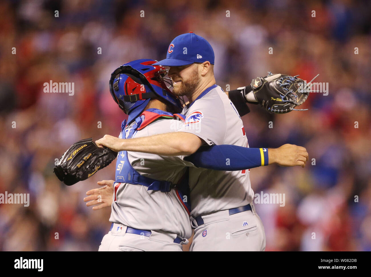 Chicago Cubs pitcher Wade Davis and catcher Rene Rivera celebrate the ...