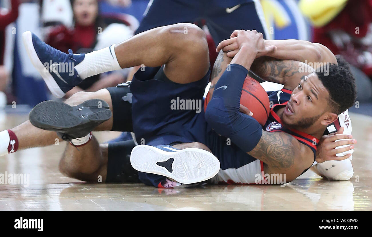 Ole Miss' Markel Crawford holds onto the basketball as he goes to the ...