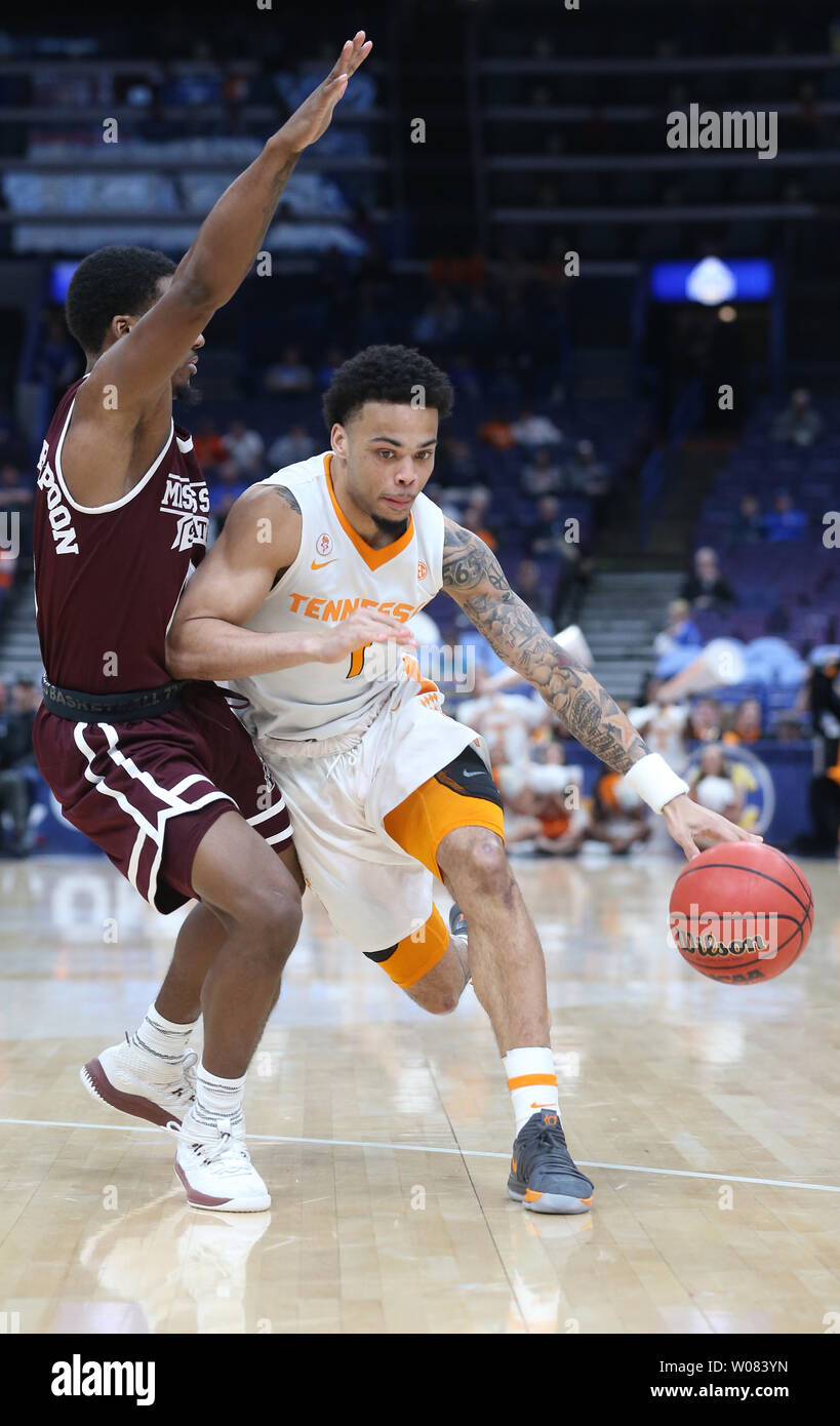 Tennessee's Lamonte Turner elbows his way past Mississippi State's Nick ...