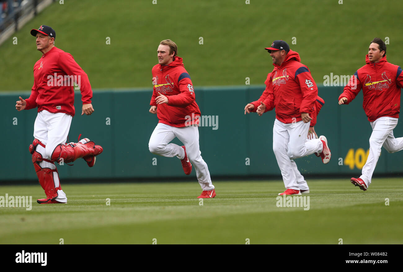 St. Louis Cardinals pitchers and catchers run in from the bullpen to ...