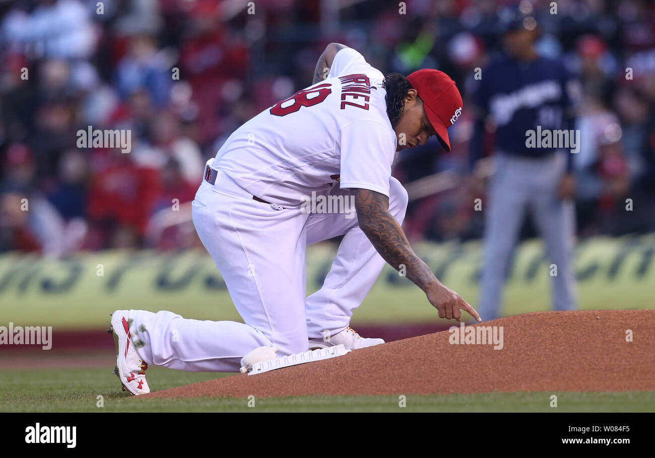 St. Louis Cardinals starting pitcher Carlos Martinez uses his finger to ...