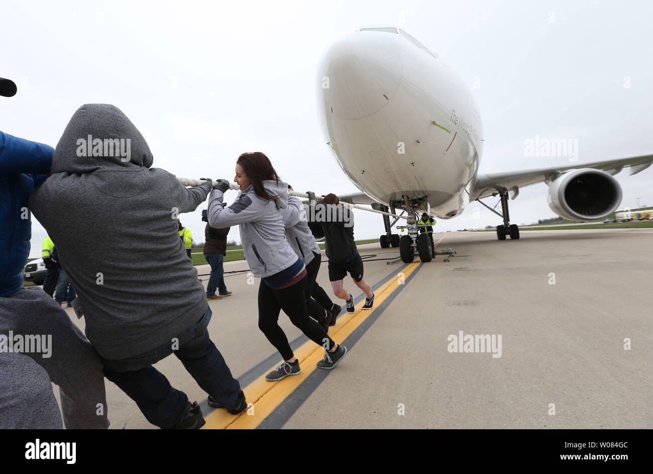 A tlocal team yank on the rope, pulling a 275,000 pound FedEx Express ...