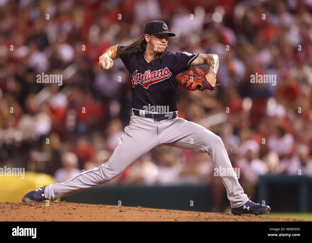 Cleveland Indians starting pitcher Mike Clevinger delivers a pitch to ...