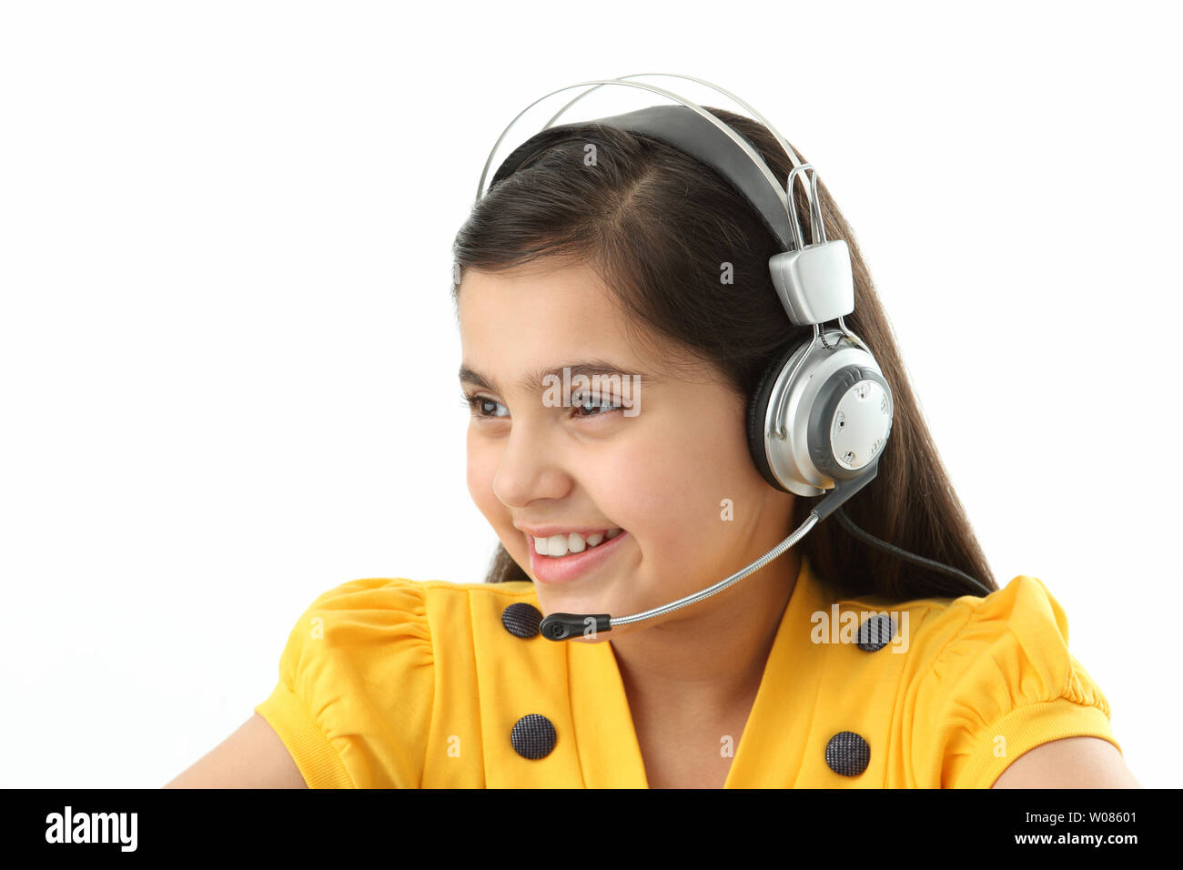 Girl wearing headset and smiling Stock Photo - Alamy