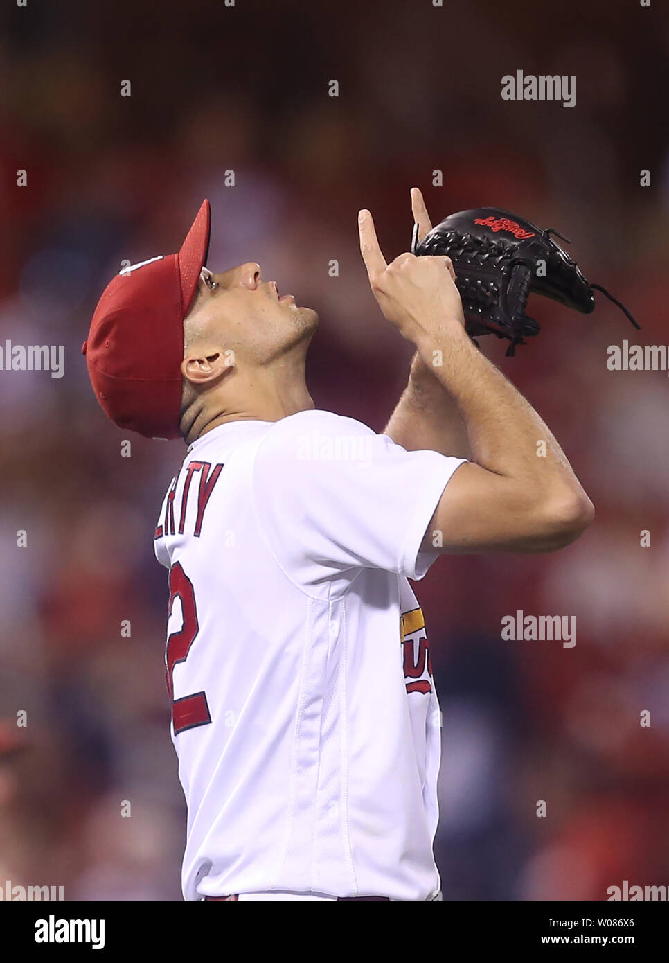 St. Louis Cardinals starting pitcher Jack Flaherty points skyward as ...