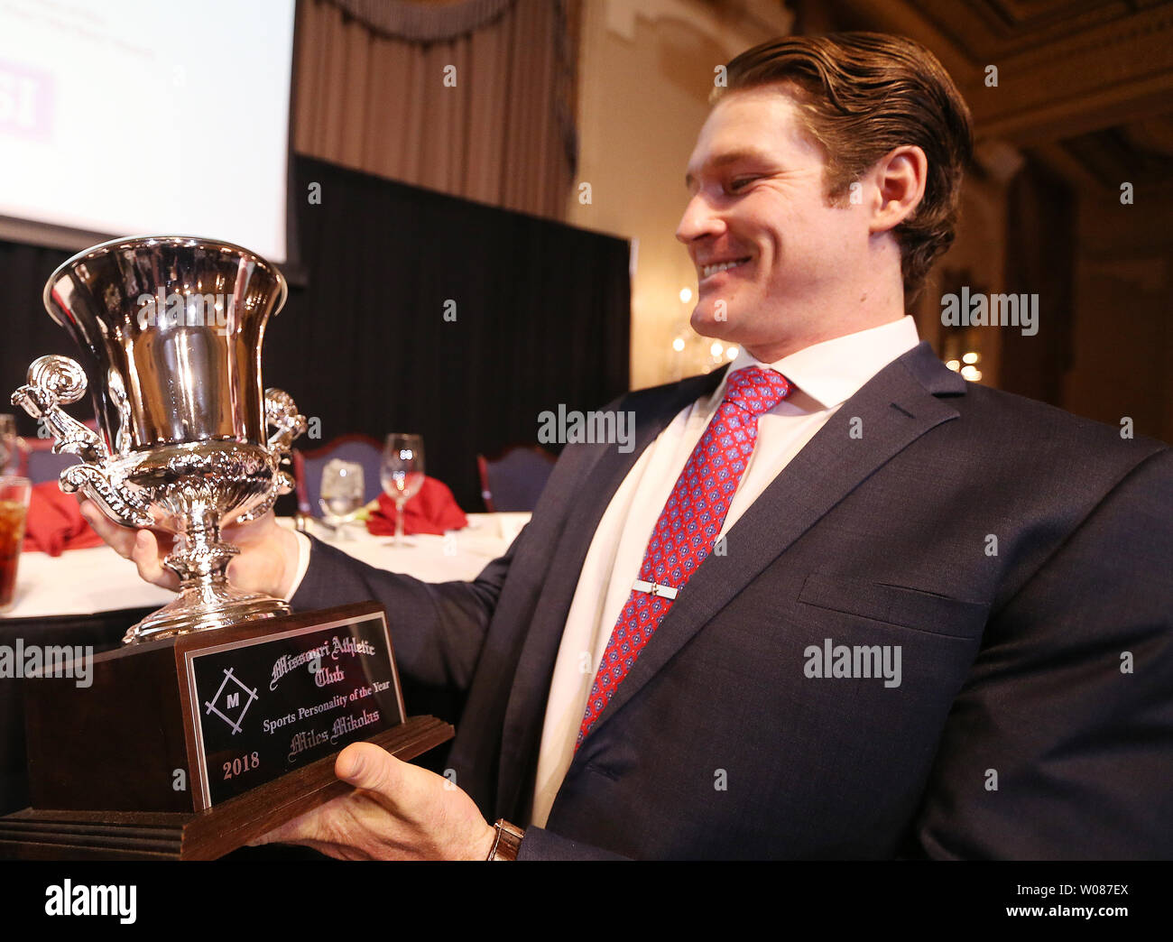 St. Louis Cardinals pitcher Miles Mikolas gets a closer look at his ...