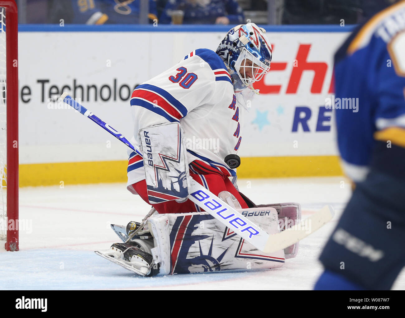 New York Rangers goaltender Henrik Lundqvist of Sweden stops a St ...
