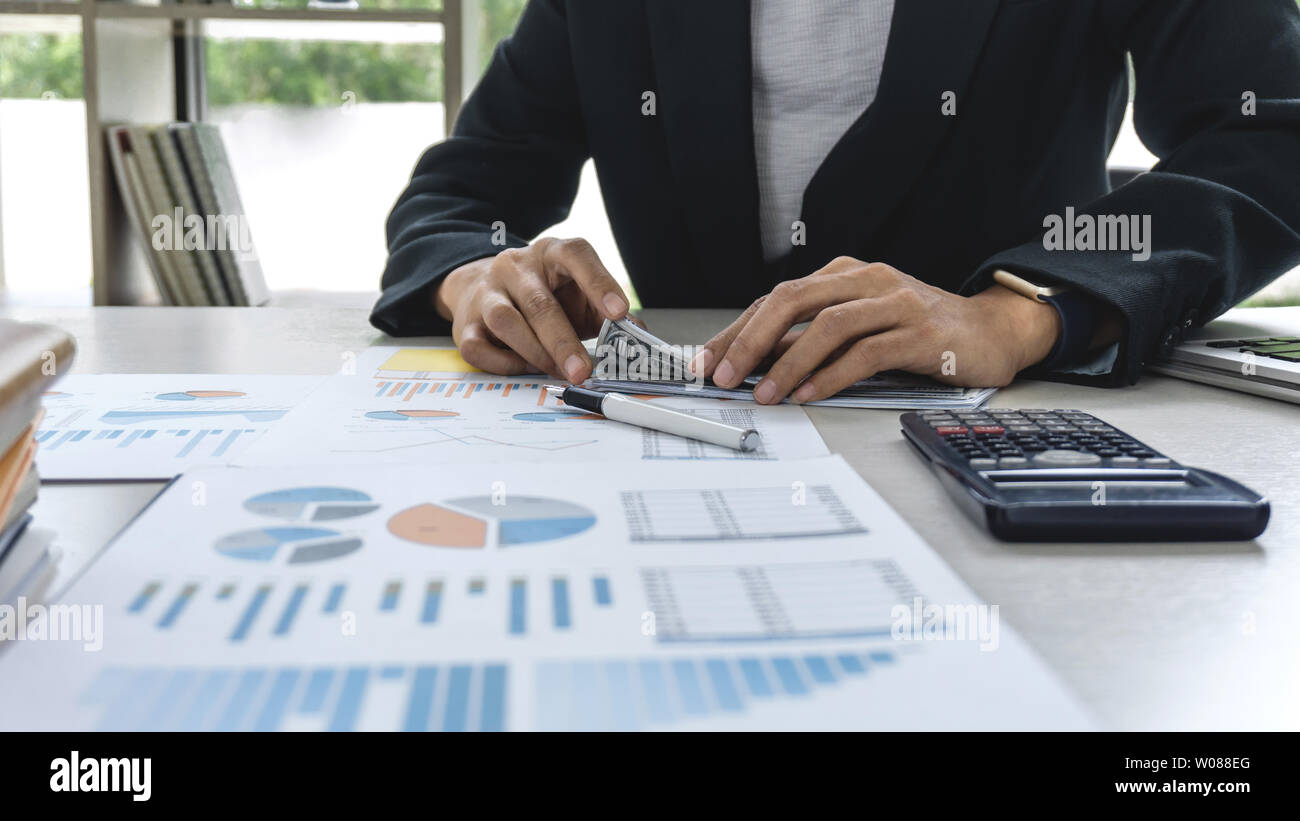 Business woman accountant working and calculating financial data on ...