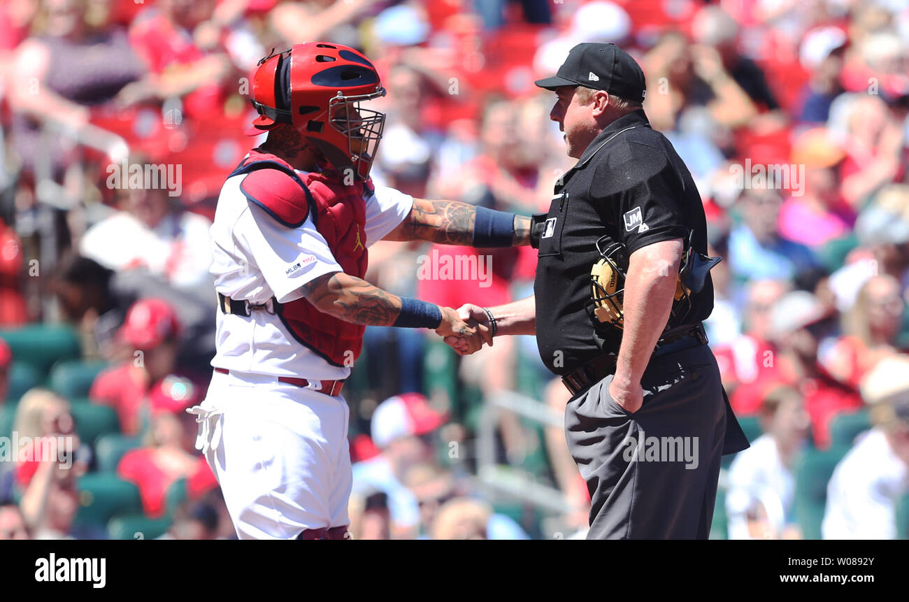 St. Louis Cardinals Yadier Molina says hello to home plate umpire Bruce ...
