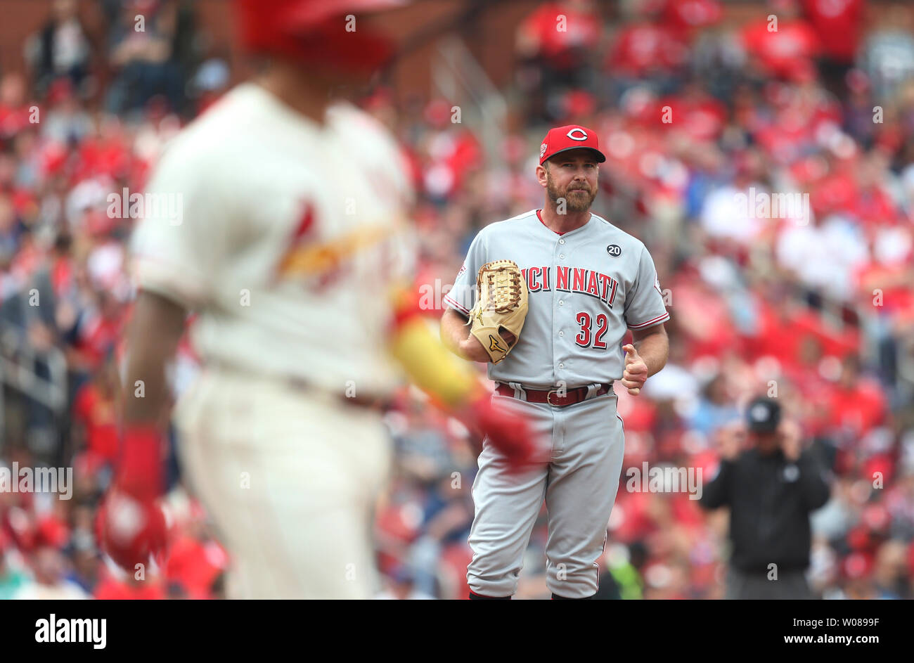 Cincinnati Reds pitcher Zach Duke watches as St. Louis Cardinals Kolten ...