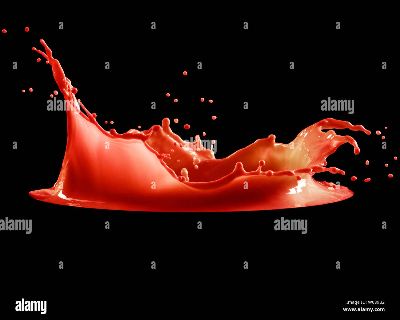 red paint splash isolated on black background Stock Photo - Alamy