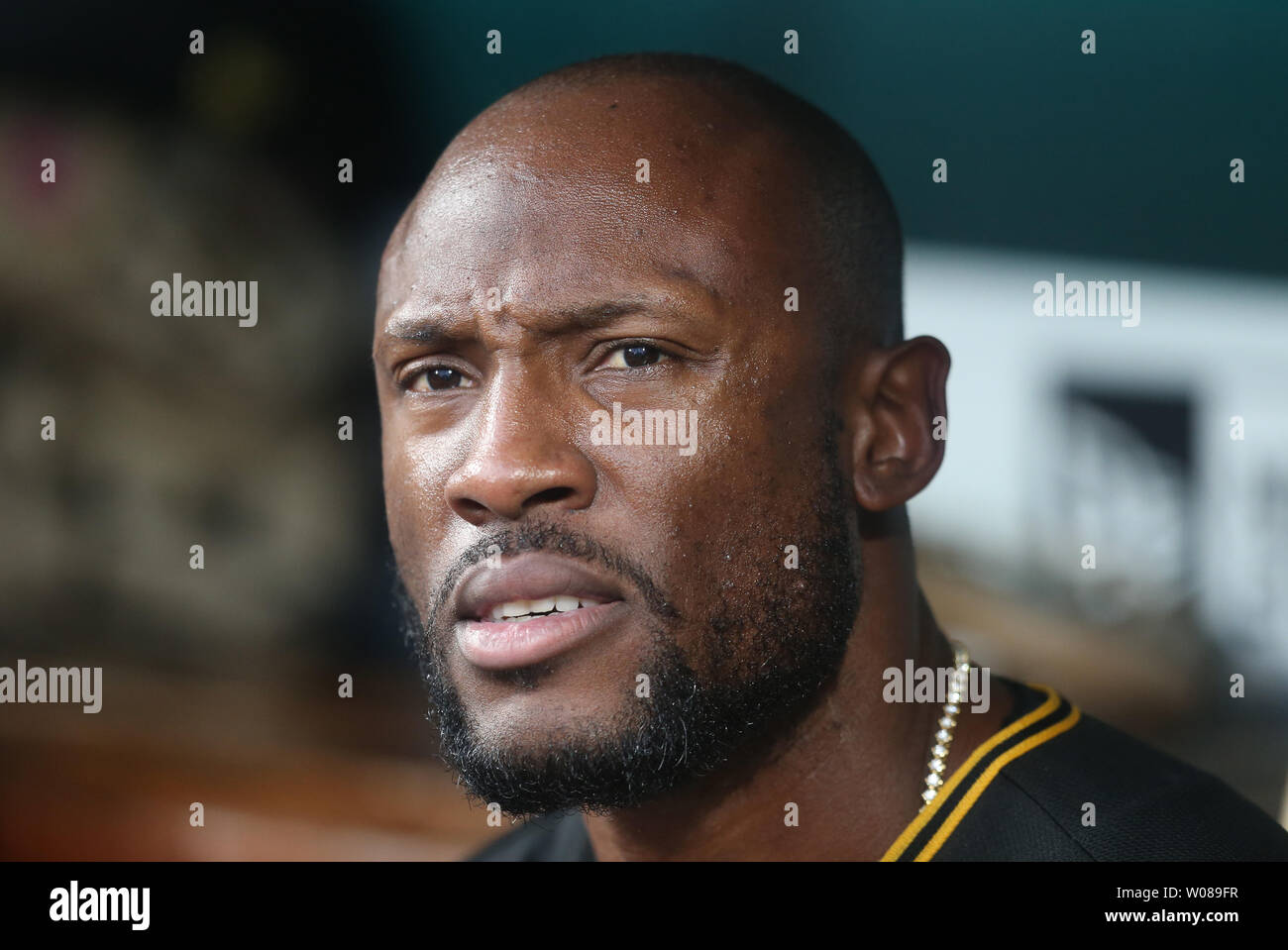 Pittsburgh Pirates Starling Marte sits in the dugout during a game ...