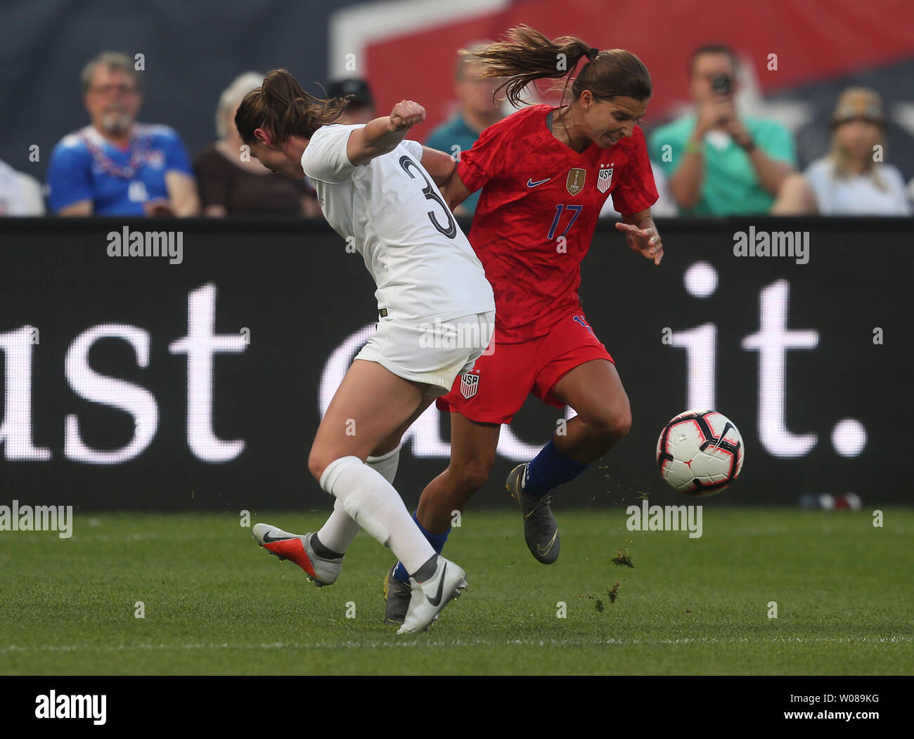 USA's Tobin Heath (17) works the ball past New Zealand's Anna Green ...