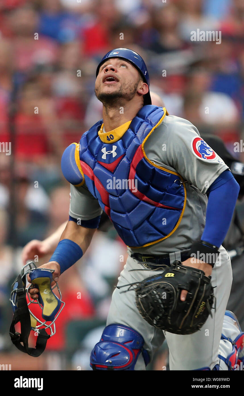 Chicago Cubs catcher Willson Contreras chaes down a foul ball off the ...