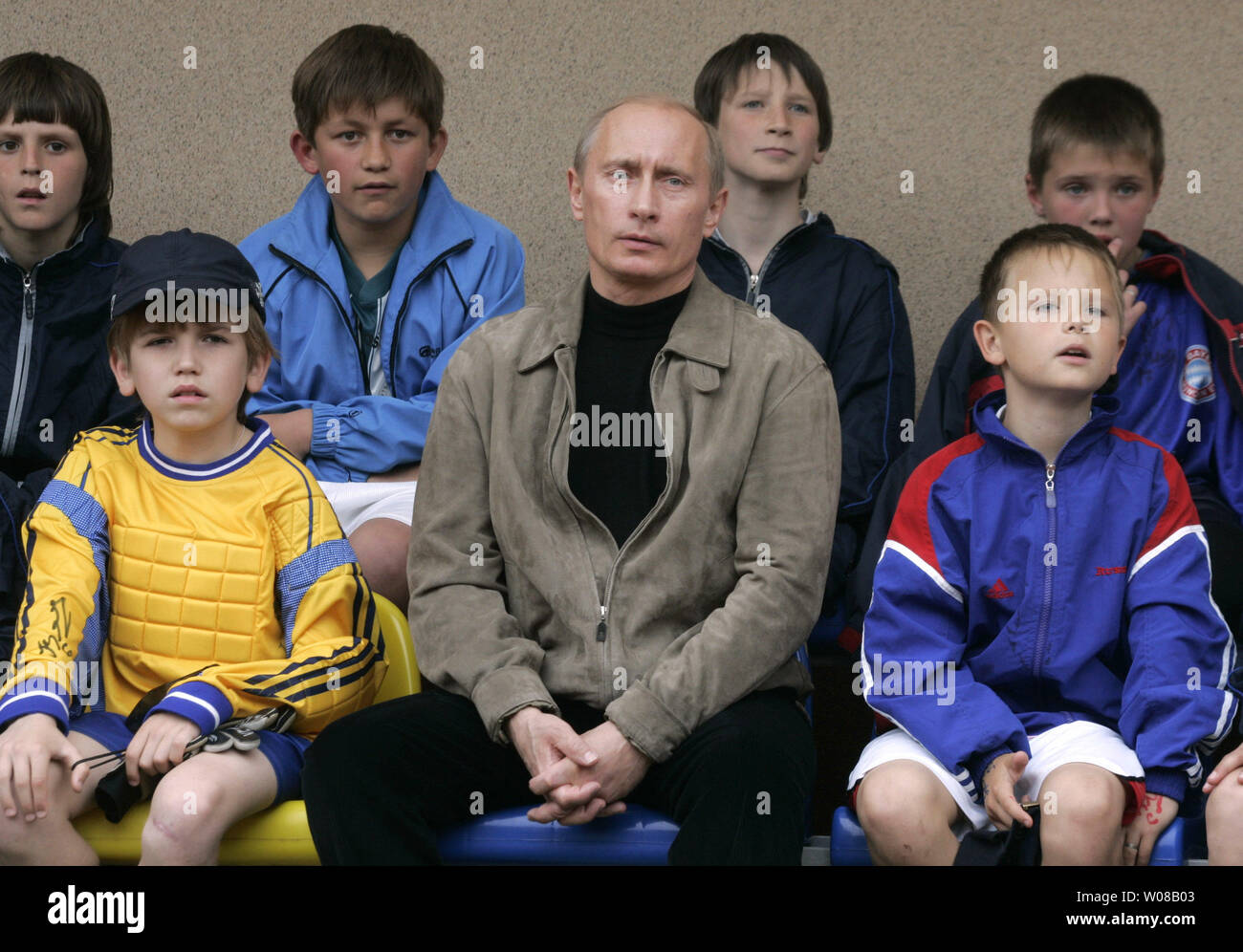 Russian President Vladimir Putin (C) meets with students of youth ...