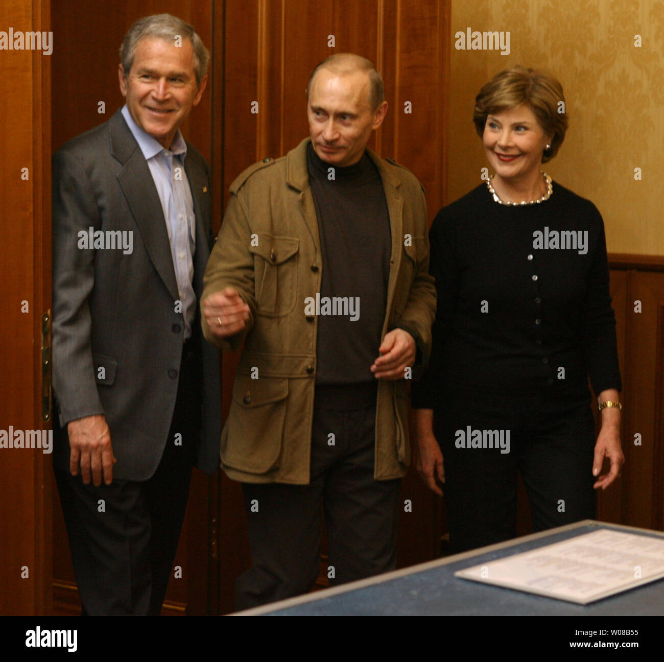 U S President George W Bush C With First Lady Laura Bush Walk With