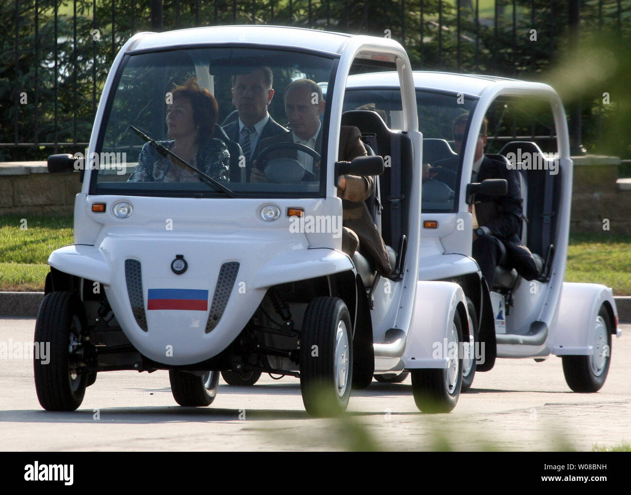 Russian President Vladimir Putin drives an electric car as he arrives ...