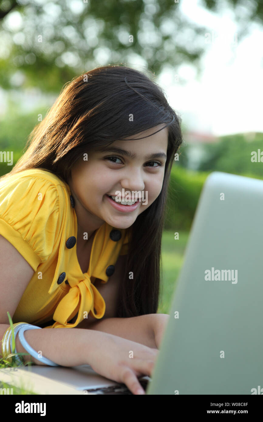 Happy Indian Girl Working On Laptop High Resolution Stock Photography ...
