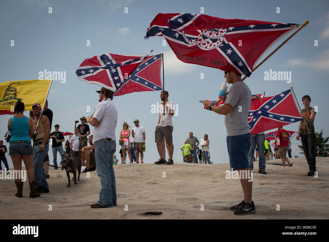 People participating in Confederate flag rally at the top of Stone ...