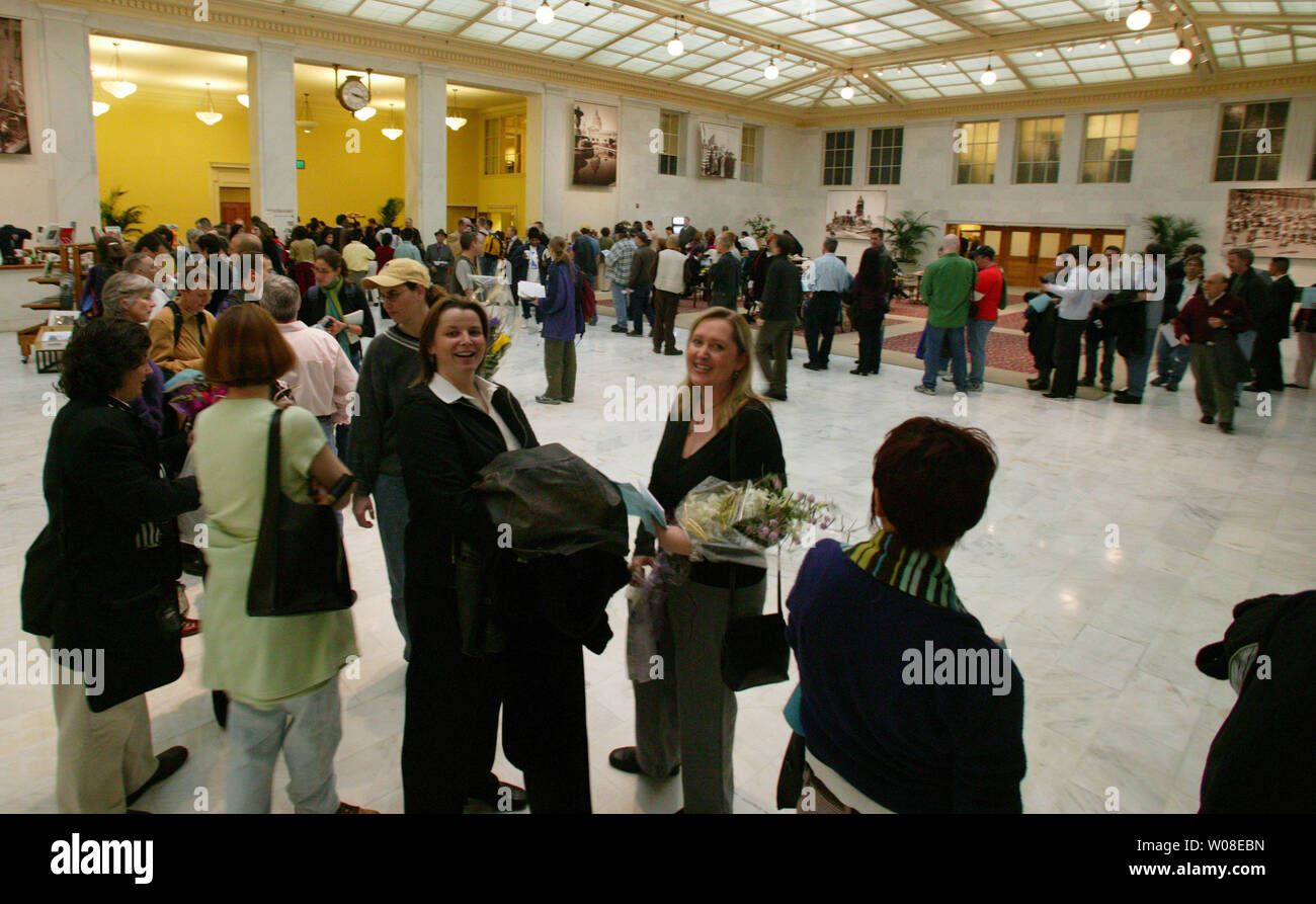 The queue for marriage licenses snakes through the north hall of City ...