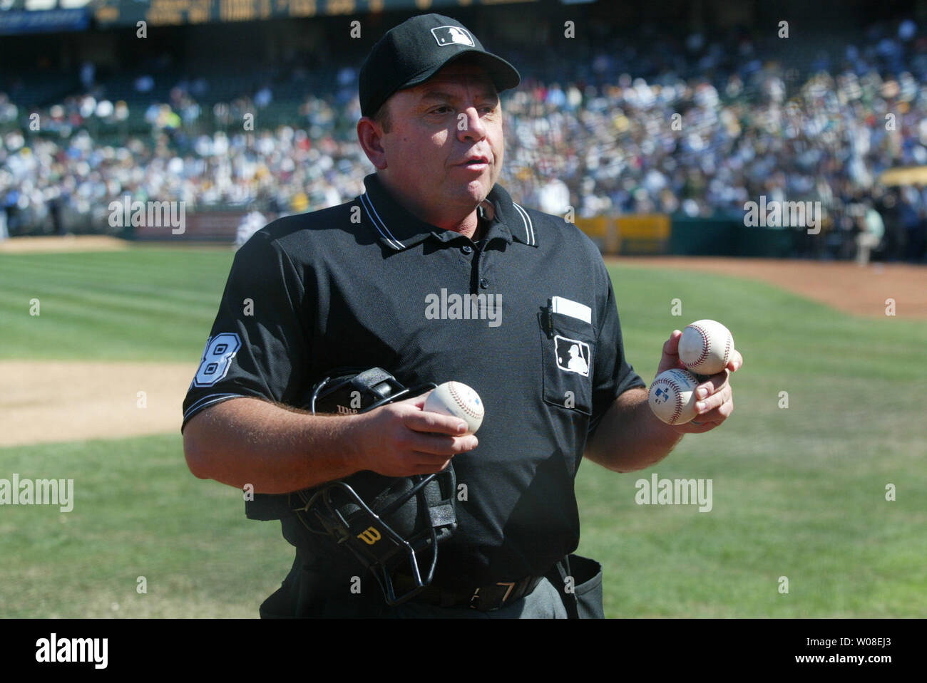 Home plate umpire Charlie Reliford get a supply of specially marked ...