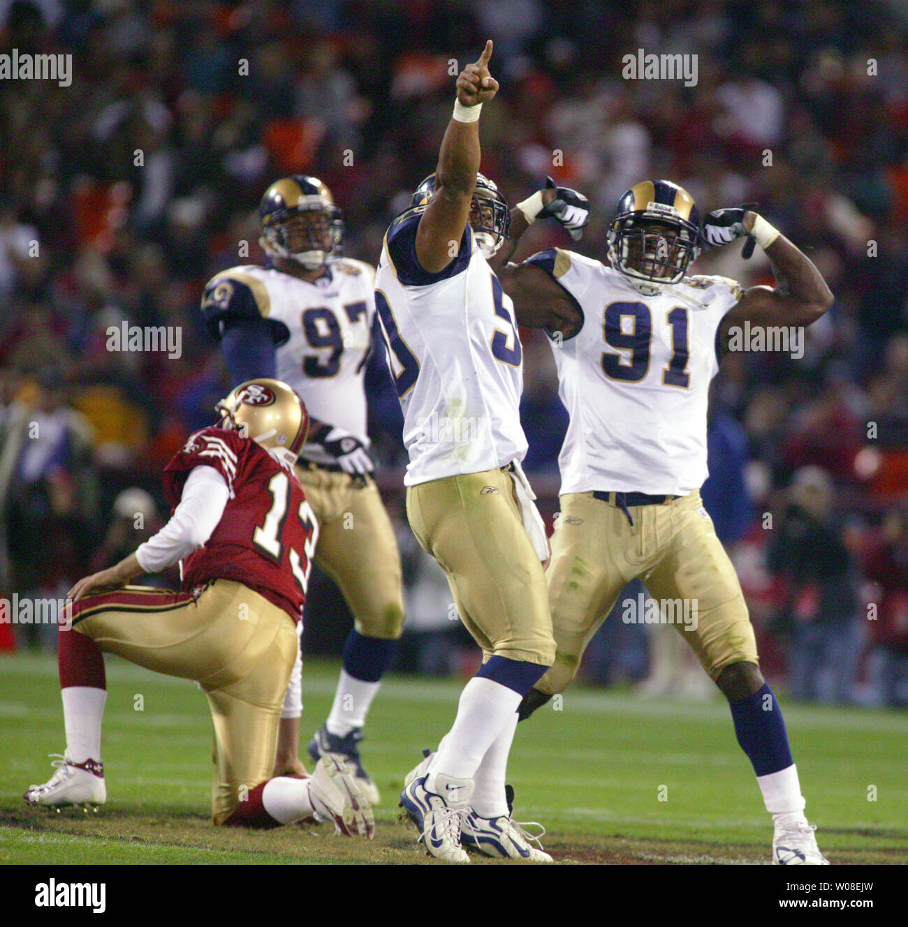 St. Louis Rams DE Leonard Little (91) and Pisa Tinoisamoa (50 ...