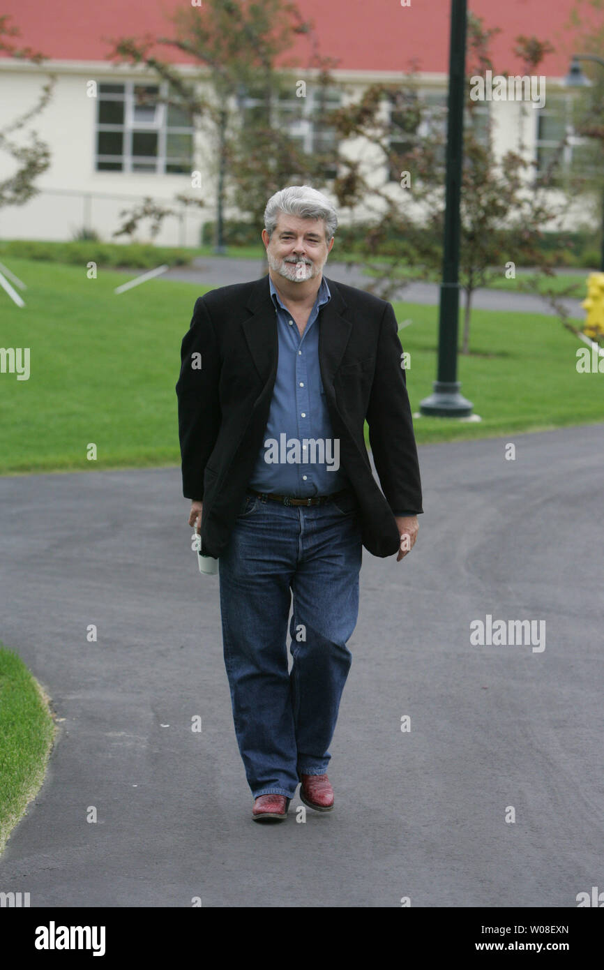 Film maker George Lucas walks in to speak with the media at the preview ...