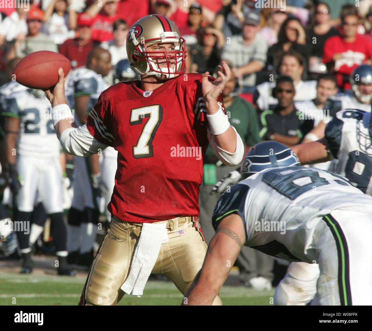 San Francisco 49ers QB Ken Dorsey throws under pressure from the ...