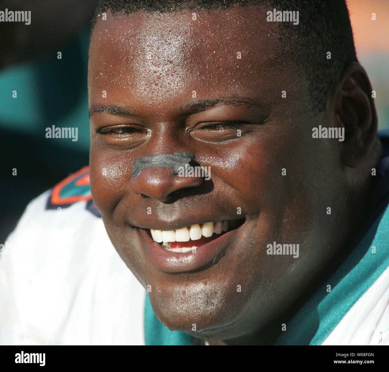 Miami Dolphins DE Kevin Carter smiles as the defense celebrates a ...