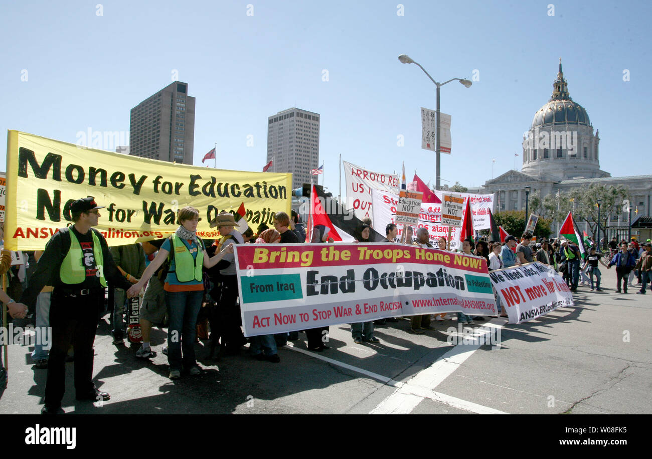 Protesters wait to march in front of City Hall at a demonstration ...