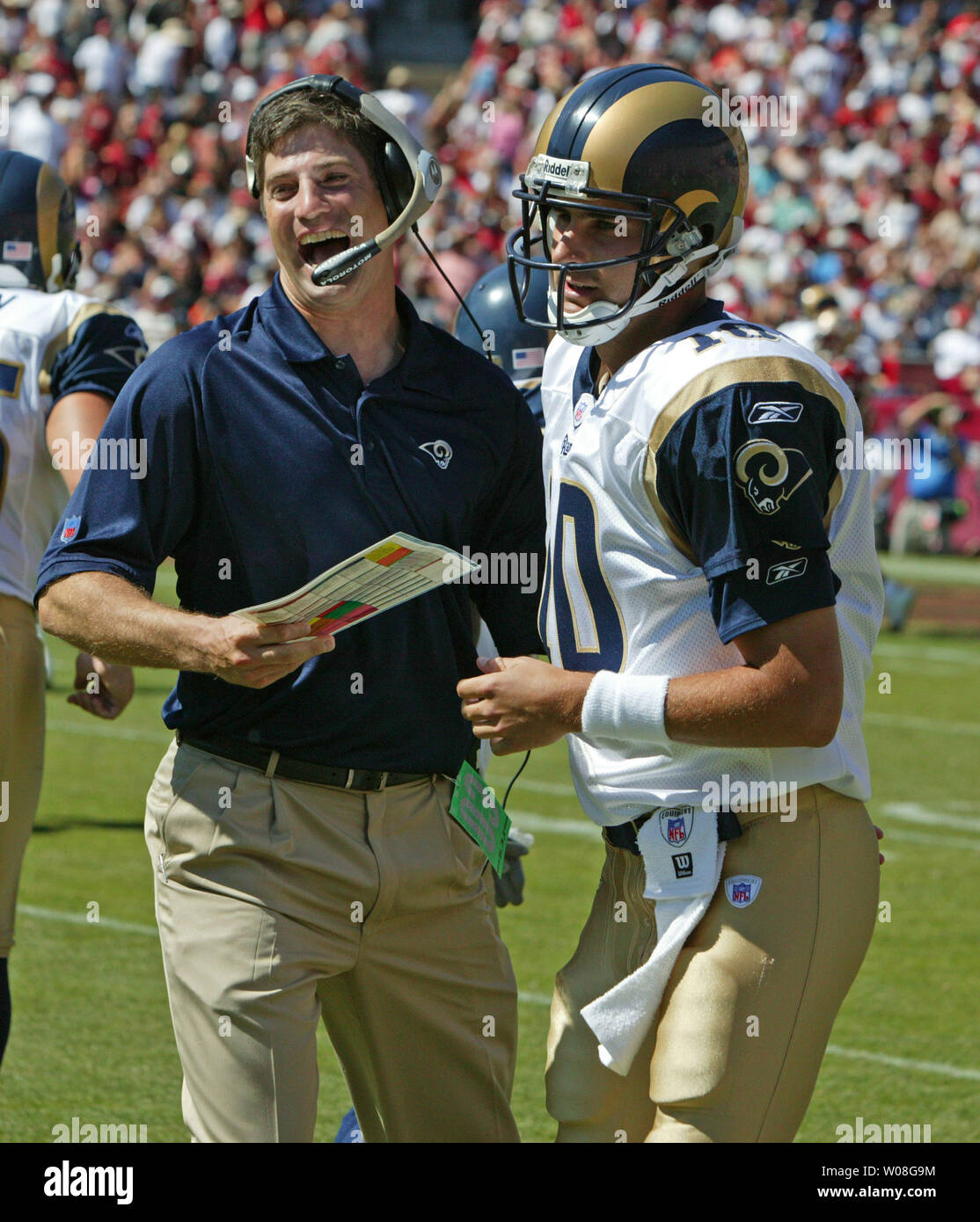 St. Louis Rams QB coach Doug Nussmeier (L) celebrates a TD pass with ...