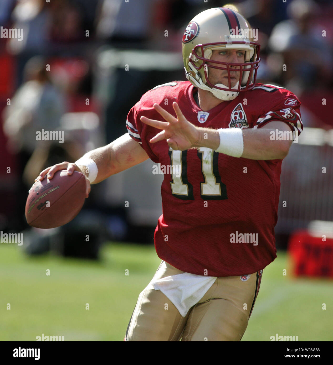San Francisco 49ers QB Alex Smith rolls out to pass in the third ...
