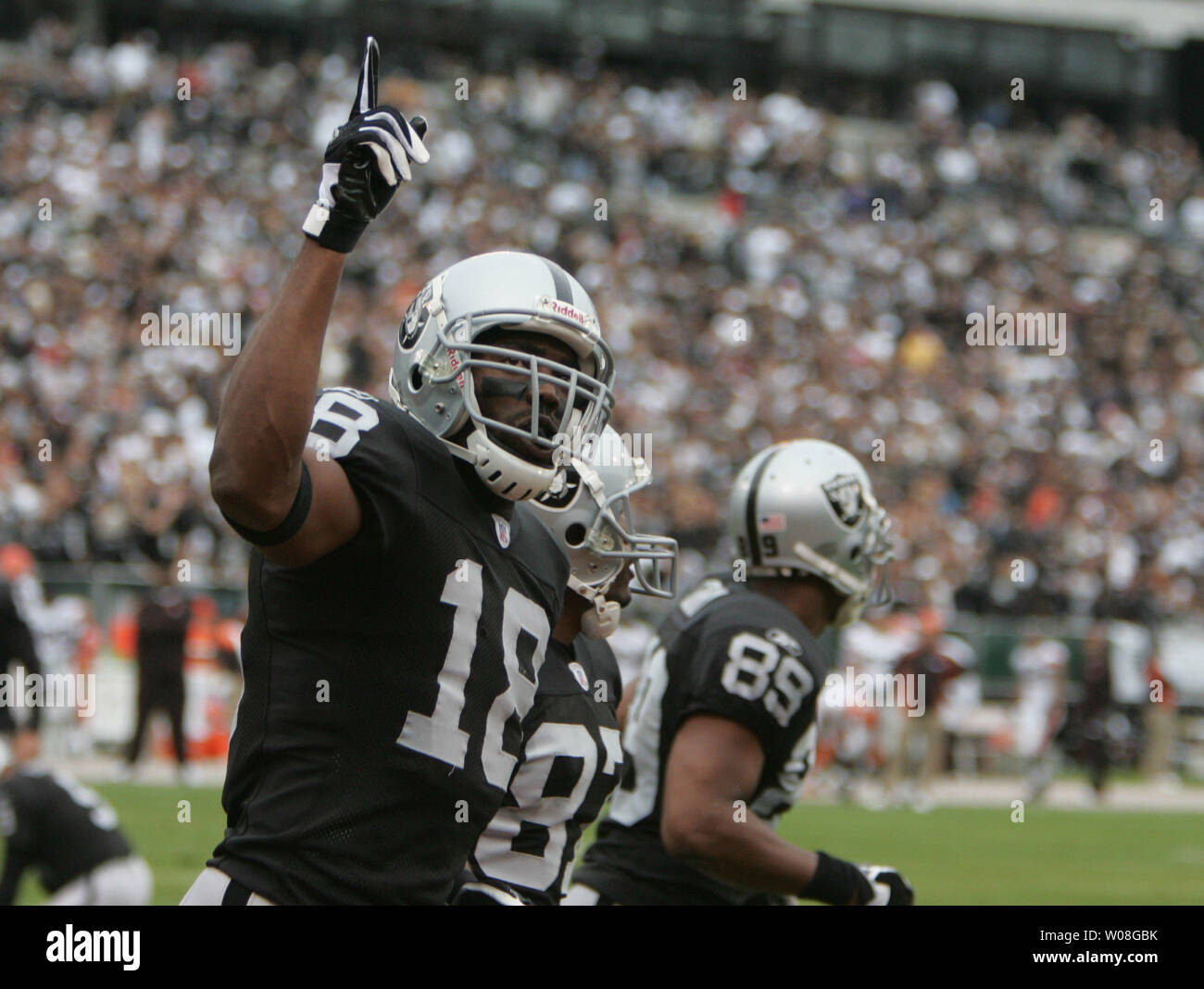 Oakland Raiders Randy Moss (18) celebrates a 5 yard TD pass from QB ...