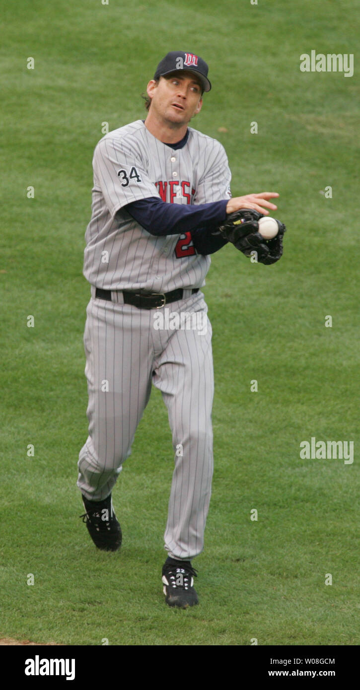 Minnesota Twins pitcher Brad Radke flubs a pop up from Oakland A's D ...
