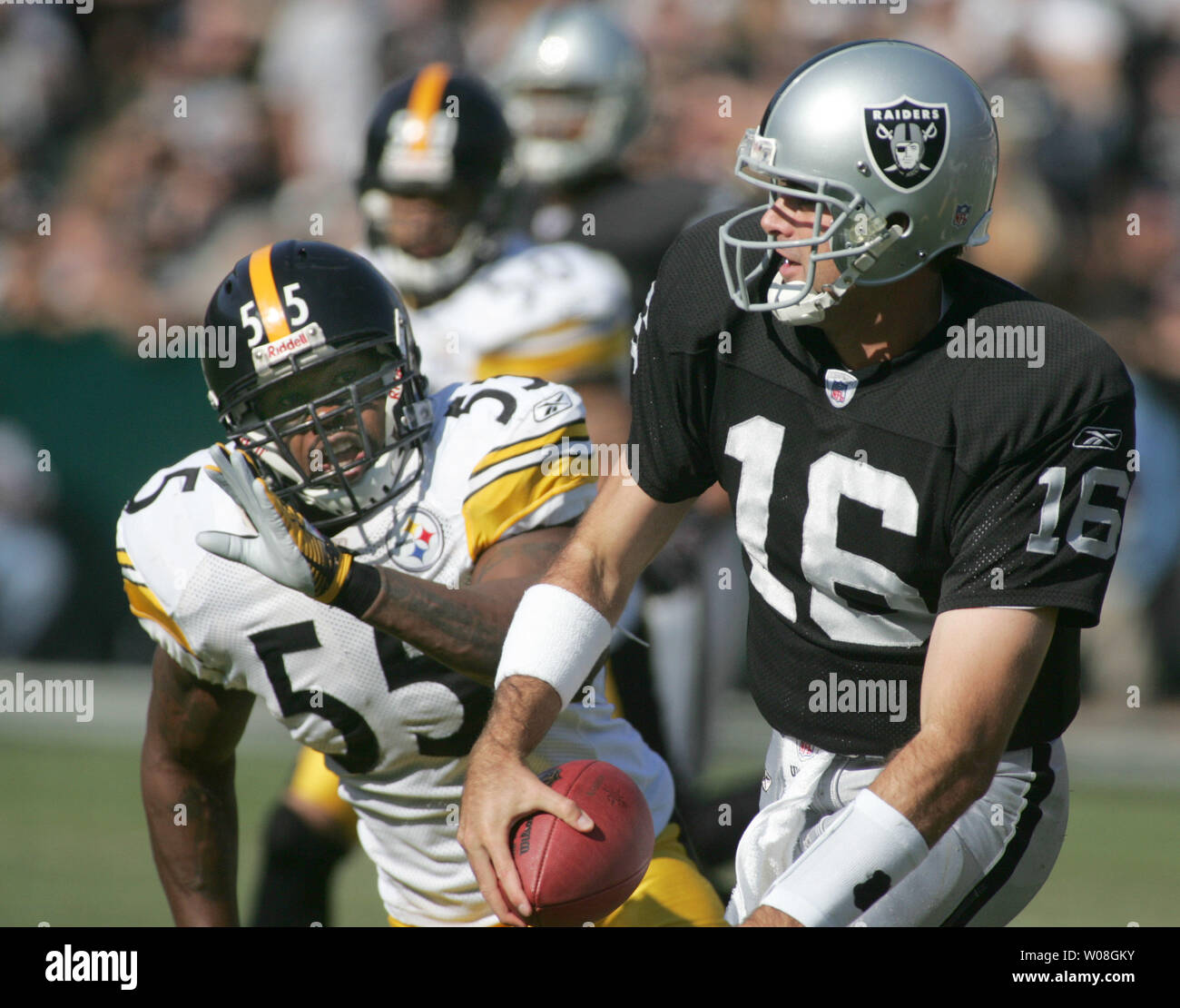 Oakland Raiders QB Andrew Walter (16) scrambles to elude pressure from ...