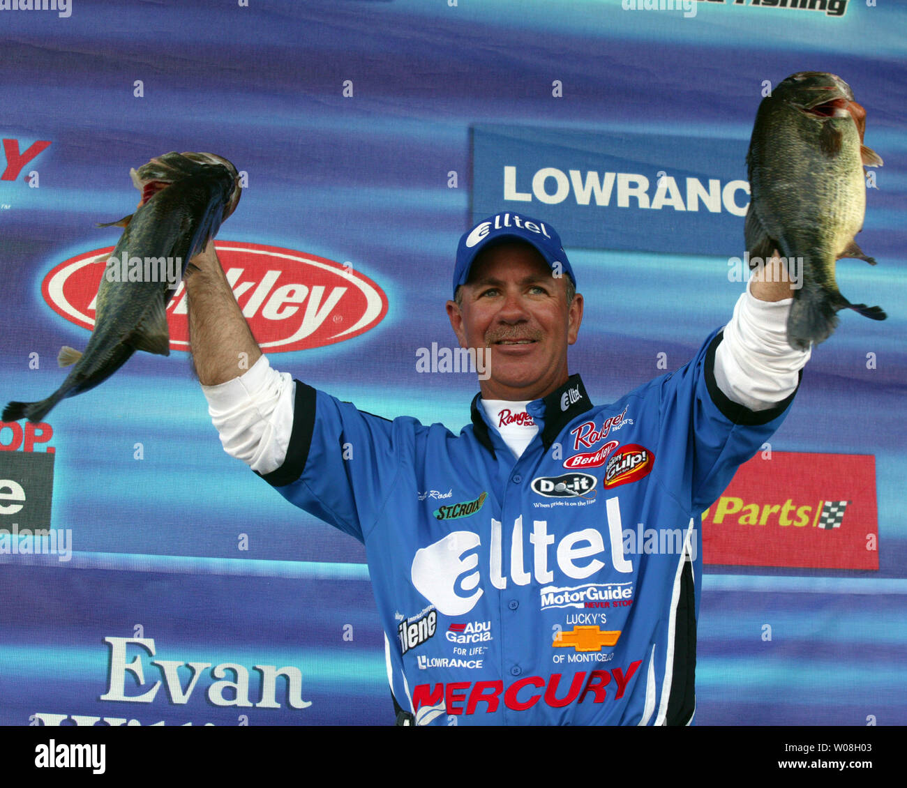 Pro angler Scott Rook from the Bassmaster Elite Series holds up two ...