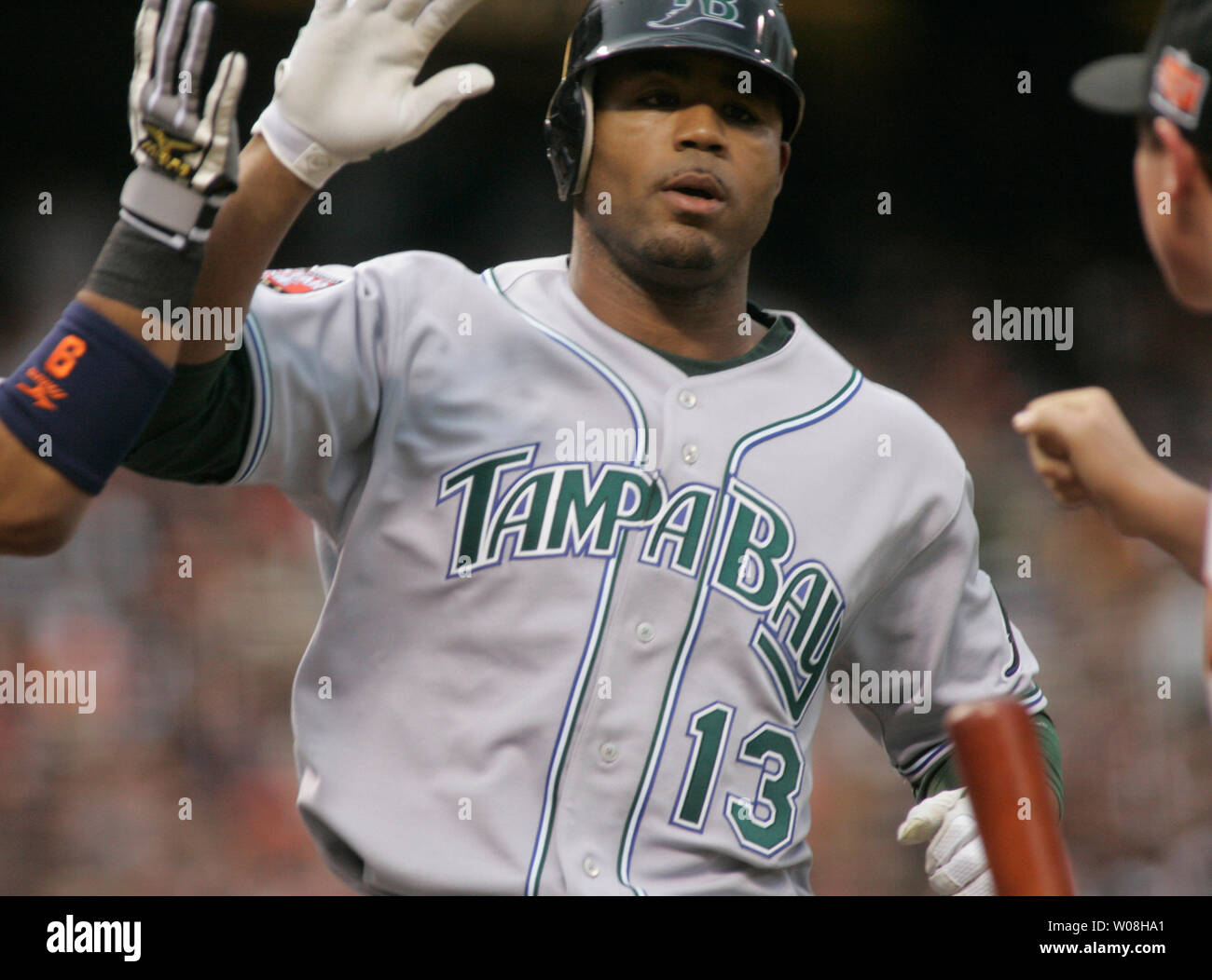 Tampa Bay Devil Rays Carl Crawford is congratulated after hitting home ...