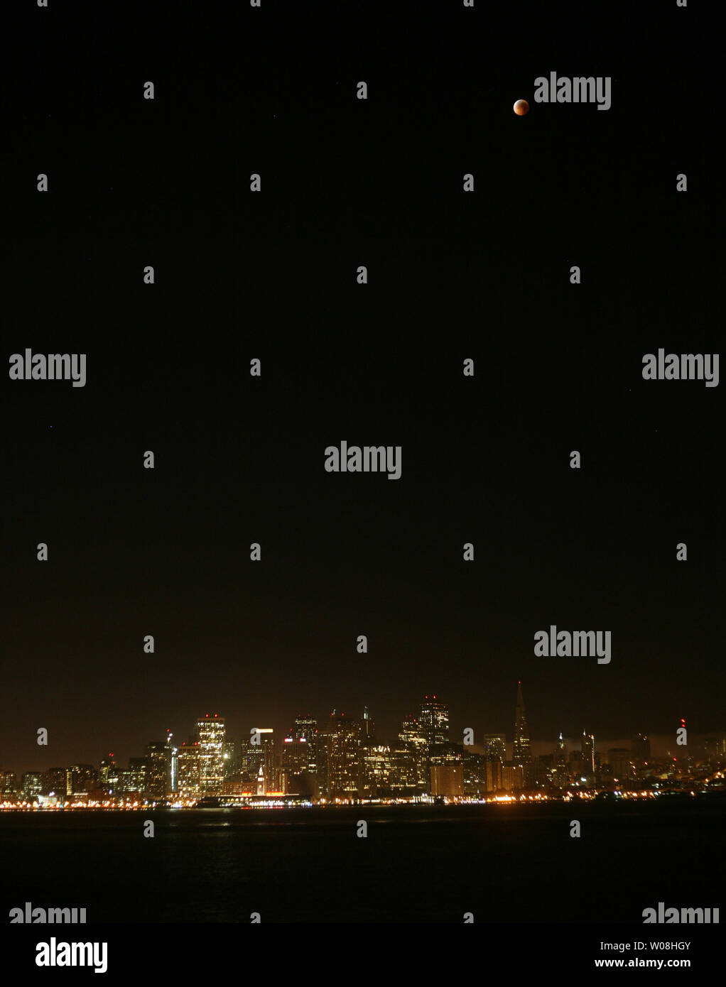 A total lunar eclipse is visible over San Francisco from Treasure ...