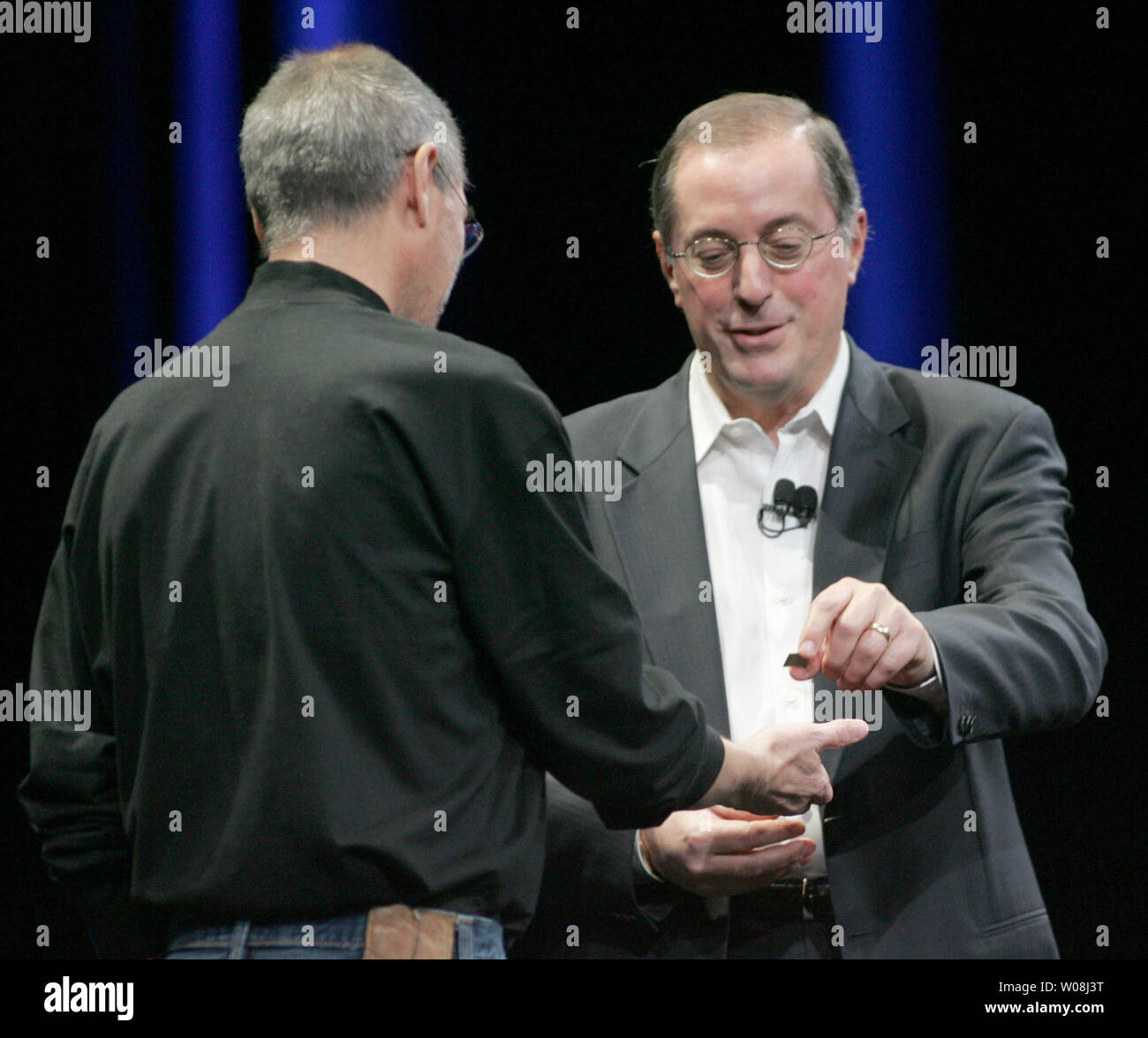 Intel's President and CEO Paul Otellini (R) gives Apple Inc. CEO Steve ...