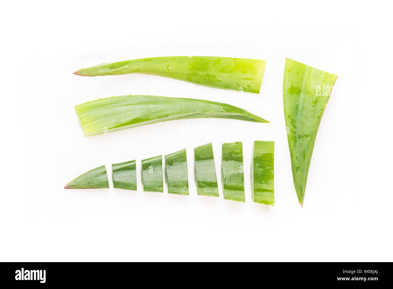 Cut aloe leaves on white background isolated Stock Photo - Alamy