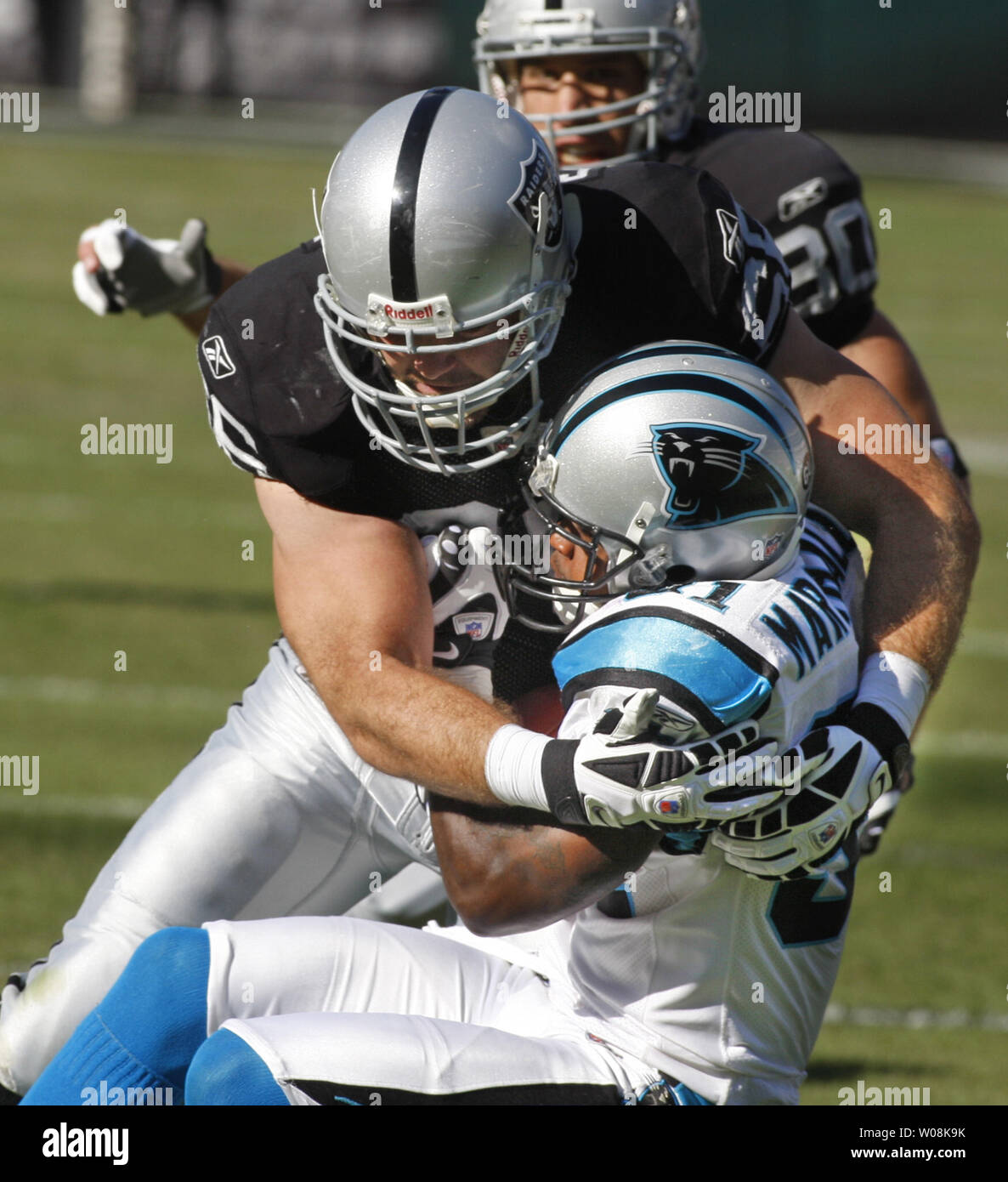 Oakland Raiders Cooper Carlisle crunches Carolina Panthers Richard ...