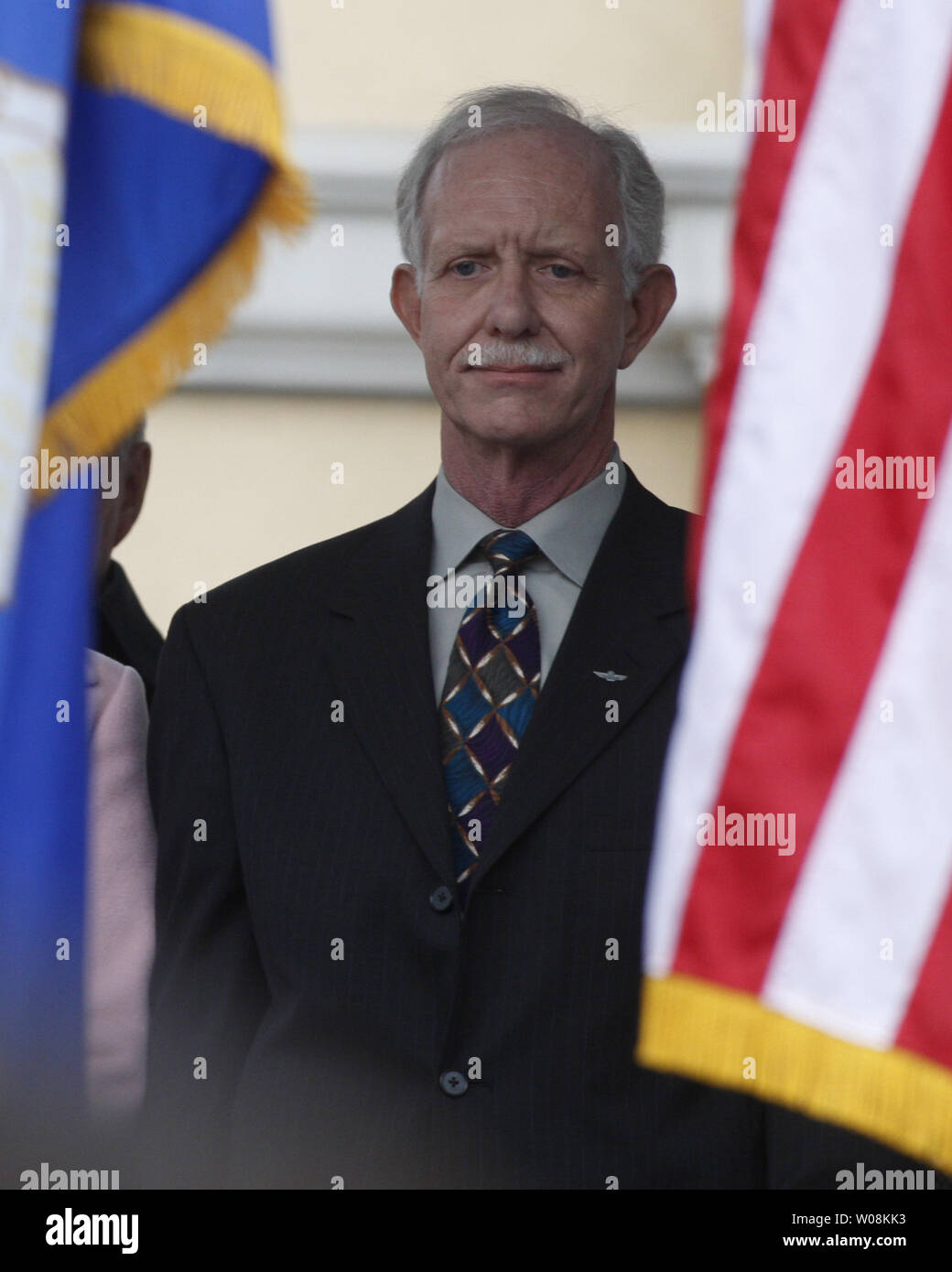 Hero pilot Captin Chesley "Sully" Sullenberber III watches the colors ...