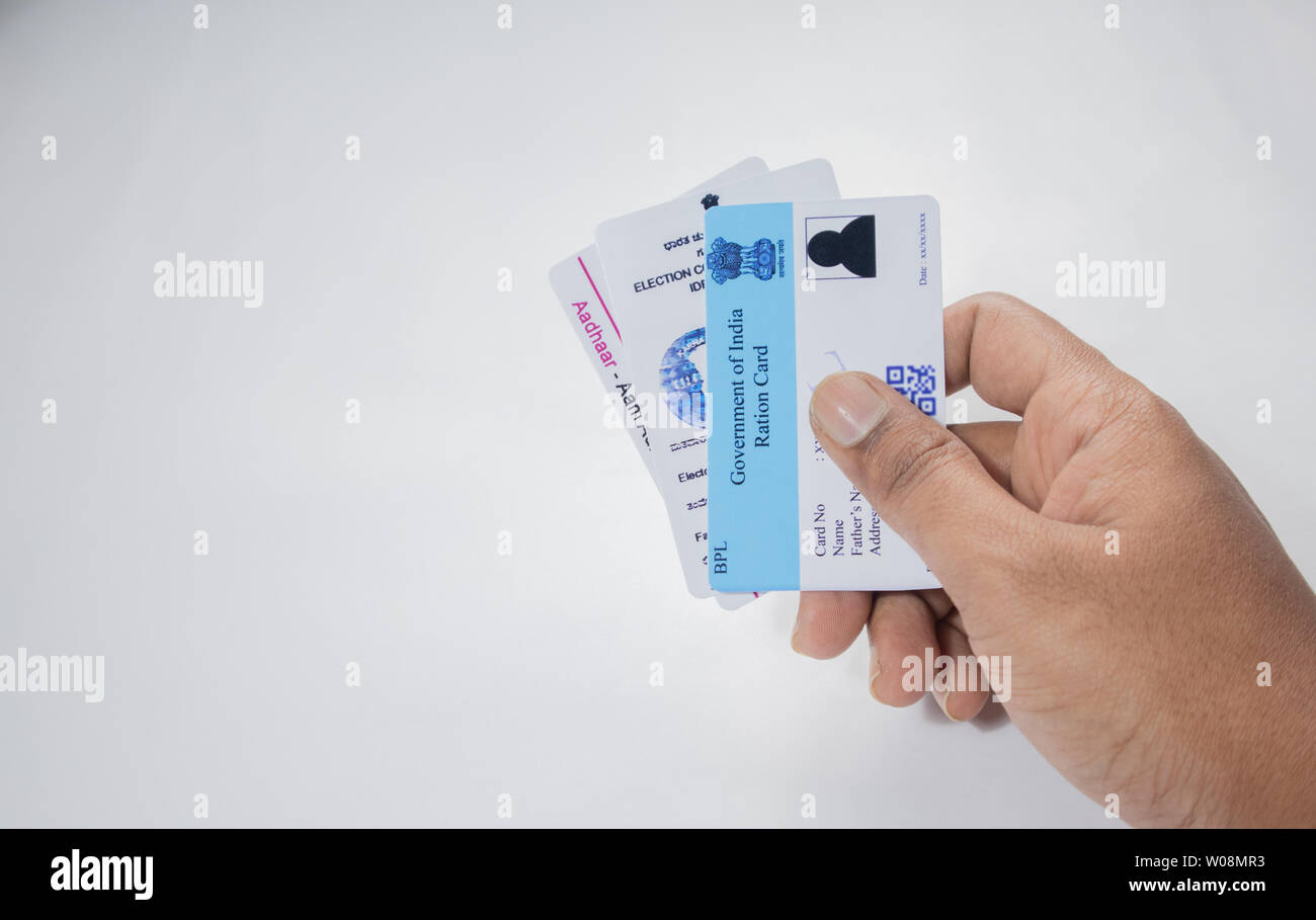 Maski,Karnataka,India -June 26 ,2019: Holding Aadhaar card, Ration card ...