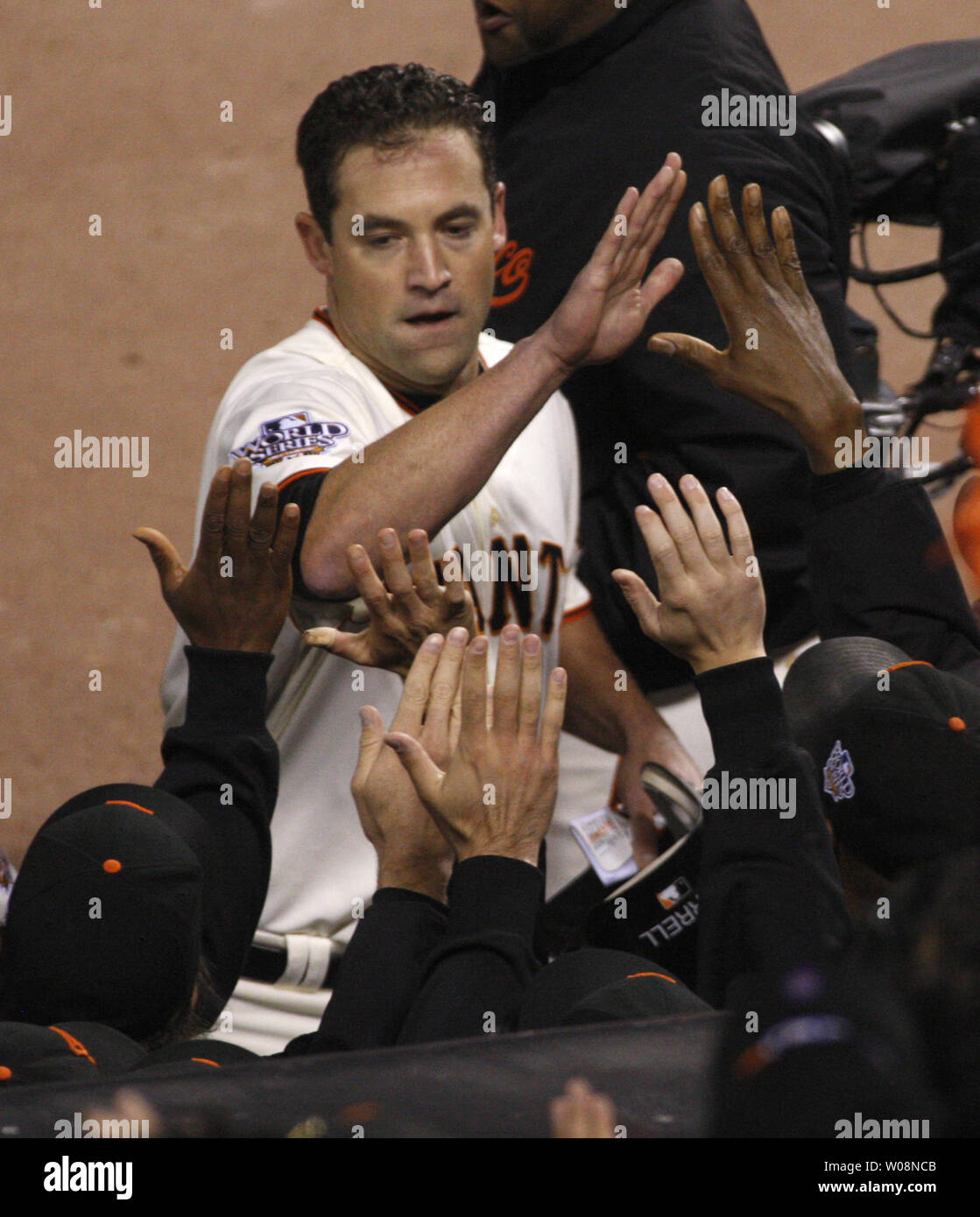 San Francisco Giants Pat Burrell gets high fives at the dugout after ...