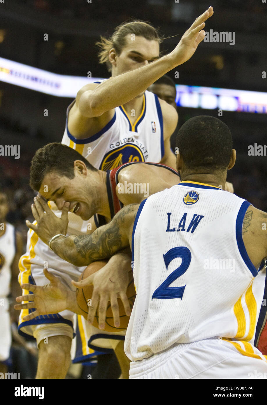New Jersey Nets Brook Lopez (C) is penned in between Golden State ...