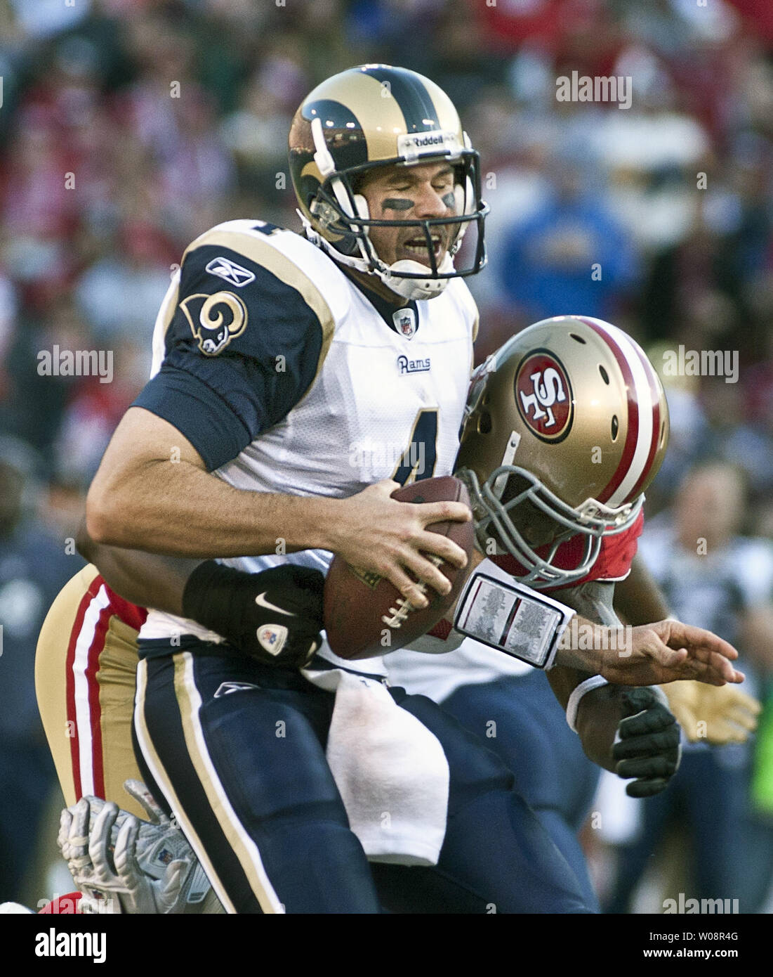 St. Louis Rams QB A.J. Feeley (4) is sacked by San Francisco 49ers Aldo ...